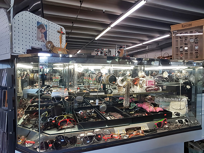 The jewelry counter gleams with possibilities, each tray a constellation of accessories waiting to complete someone's perfect outfit.