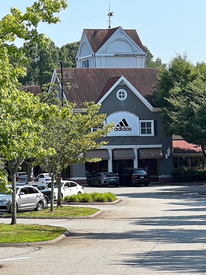 The Adidas store stands tall like a cathedral of sportswear, its iconic logo a beacon for sneakerheads and weekend warriors alike.