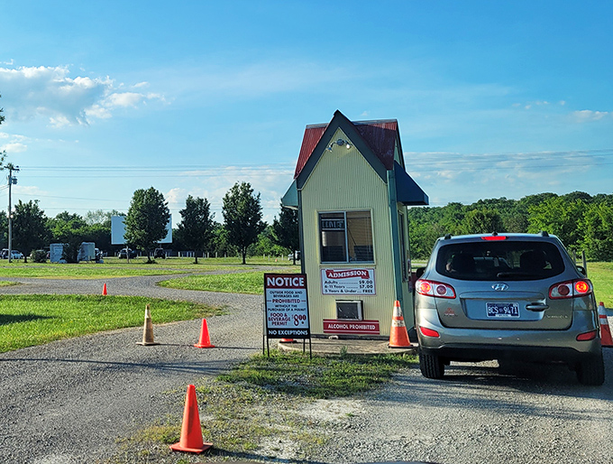 Approaching the admission booth feels like stepping back in time. Orange traffic cones guide you toward an evening of nostalgic entertainment.