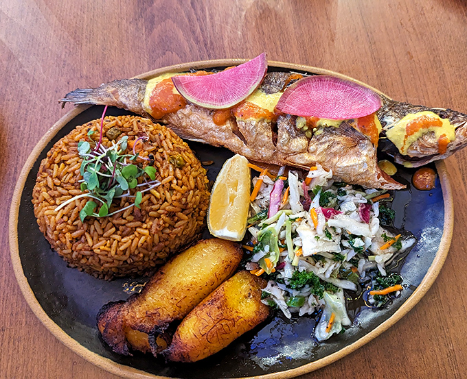 A feast for all senses: perfectly fried plantains alongside tender fish, with vibrant watermelon radish adding pops of color like edible confetti.