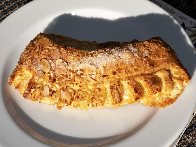 This almond bear claw isn't just a pastry; it's what angels must eat for breakfast when they're feeling particularly deserving.