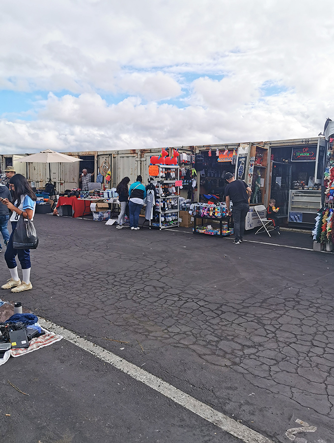 Storage containers meet fashion accessories in this eclectic display. The swap meet's version of "one person's storage solution is another's treasure."
