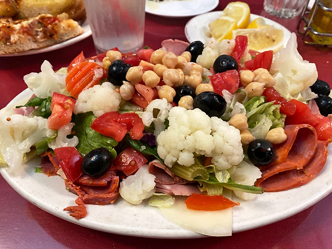 An antipasto salad that's like the United Nations of appetizers – bringing cauliflower, olives, salami, and chickpeas together in delicious diplomatic relations.