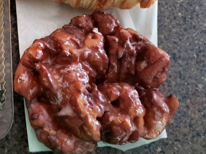 This apple fritter isn't just breakfast&mdash;it's a craggy mountain of glazed perfection that makes you forget you ever knew what a diet was.