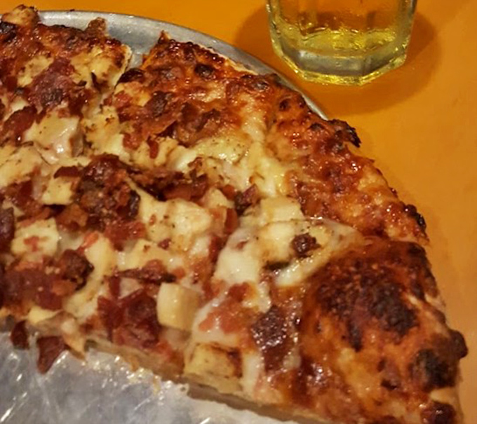 Close-up perfection reveals the beautiful marriage of melted cheese and toppings &ndash; where every bite delivers that perfect textural contrast.