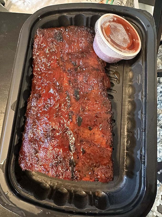 Ribs so glossy you could check your reflection in them. The sauce-to-meat ratio here is what mathematicians call "the golden proportion."