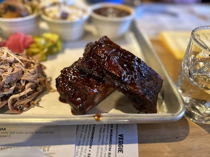 Ribs so tender they practically surrender to your fork. That glossy, caramelized exterior is barbecue's equivalent of a perfect sunset.