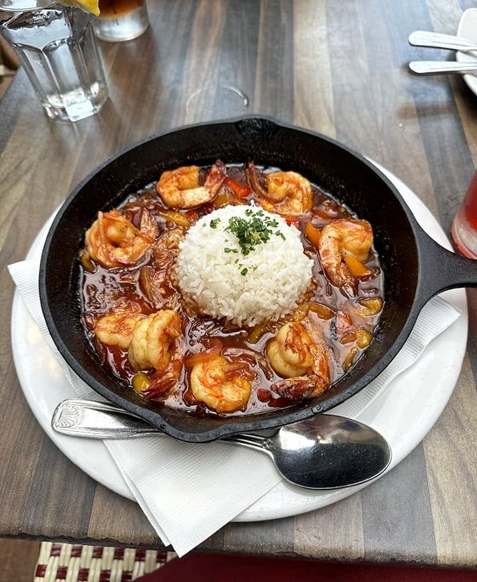 The New Orleans BBQ shrimp arrives like a delicious hurricane in a skillet&mdash;rich sauce, plump shrimp, and that island of rice in the center for soaking up flavor.