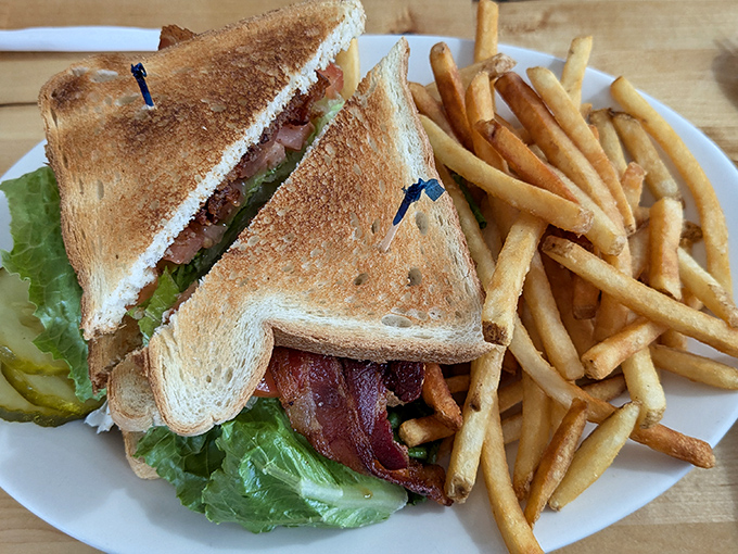 The humble BLT elevated to art form&mdash;crispy bacon, garden-fresh lettuce, and juicy tomato between perfectly toasted bread, with fries standing by for dipping duty.