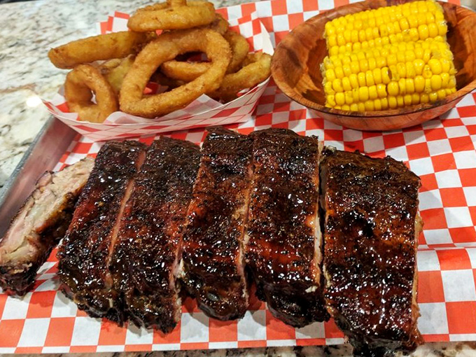 Baby backs glistening with a lacquer that would make furniture restorers envious. The corn on the side is just there for moral support.
