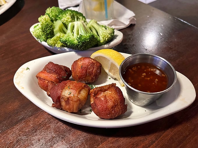 Bacon-wrapped seafood bites served with a tangy dipping sauce &ndash; proof that sometimes the simplest pleasures are wrapped in bacon.