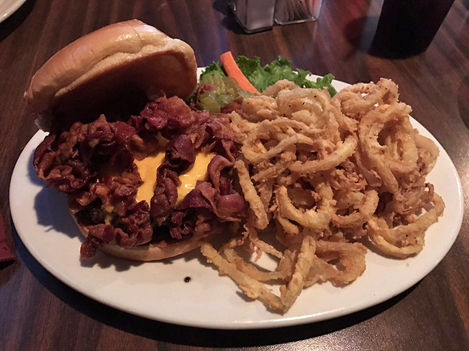 Bacon cheeseburger piled high with crispy onion rings proves that some food combinations were simply meant to be together forever.
