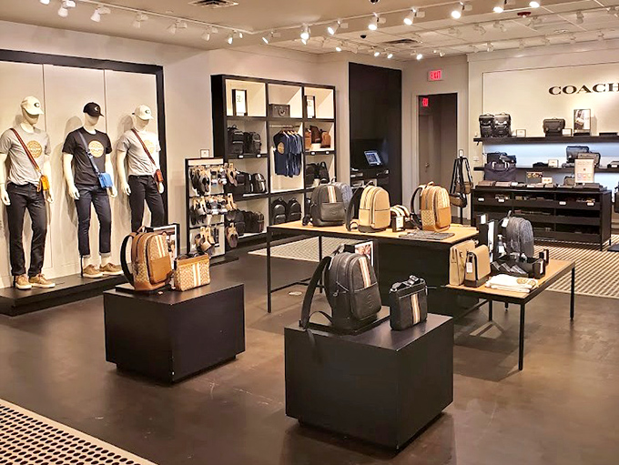 Coach's minimalist display proves luxury doesn't have to shout. These bags whisper "I have excellent taste" instead of screaming "Look what I spent!"