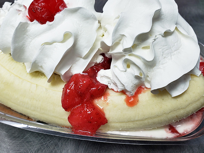 Banana splits aren't just desserts, they're architectural achievements&mdash;this one has enough whipped cream to make your childhood self weep with joy.