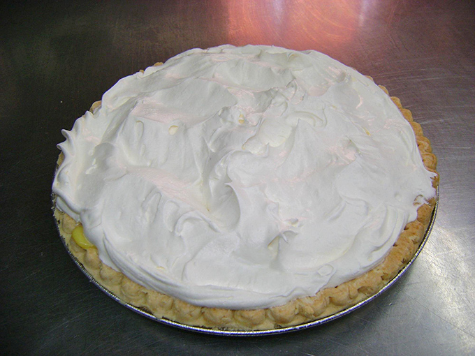 Cloud-like meringue crowning a banana cream pie so heavenly it makes grown adults contemplate licking the plate when nobody's looking.