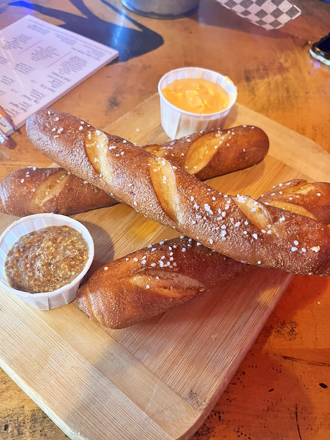Bavarian pretzels that would make Munich proud, sprinkled with salt crystals and served with dipping sauces worth fighting over.