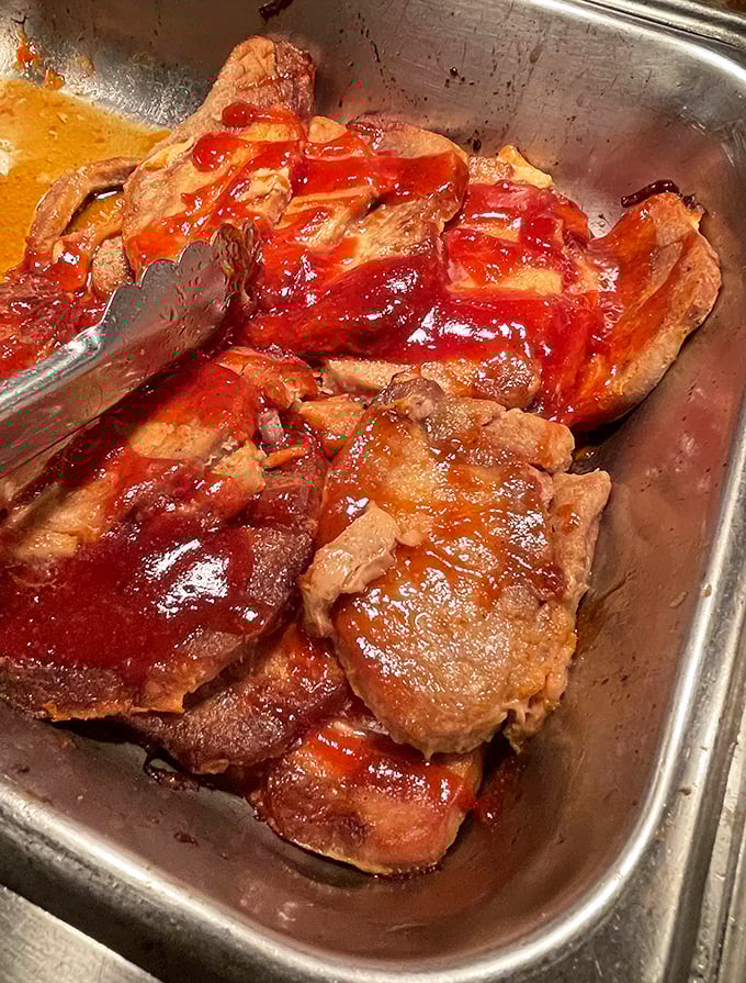 BBQ pork glistening with that perfect sticky-sweet glaze. The kind of dish that makes vegetarians momentarily question their life choices.