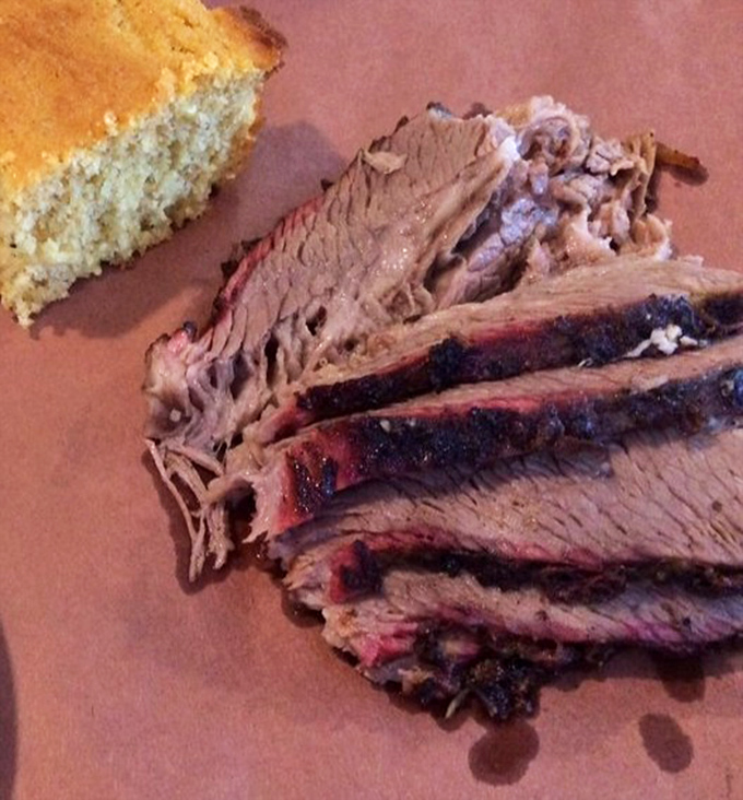 Brisket with that perfect pink smoke ring and cornbread sidekick&mdash;a duo more satisfying than finding both socks after laundry day.