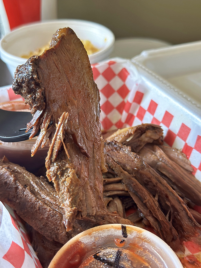 Brisket so tender it practically surrenders at the sight of a fork. That smoke ring isn't just for show—it's a pink badge of barbecue honor.