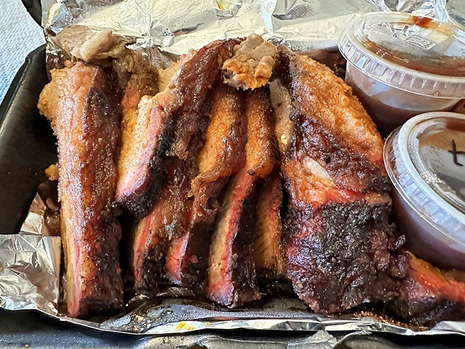 Smoke ring perfection: These ribs have that telltale pink edge that whispers, "I've been babied for hours in the smoker."