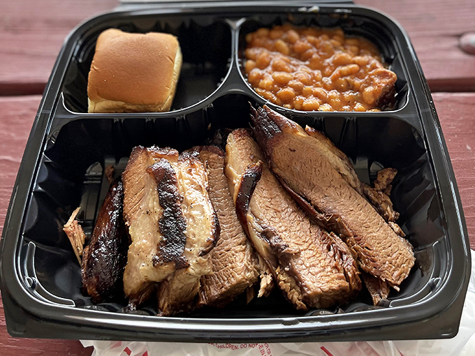 Brisket so tender it makes you wonder if the cow was massaged daily while listening to smooth jazz. The smoke ring is practically a halo.