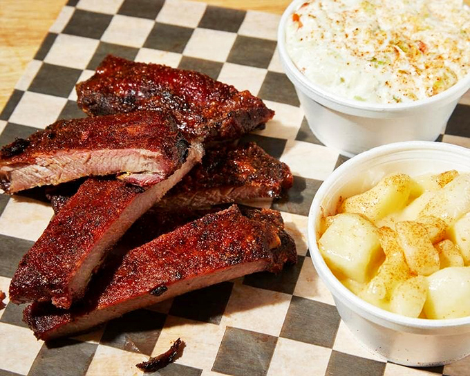 These ribs have that perfect mahogany color that whispers "take me home"&mdash;paired with classic sides that know their supporting role.