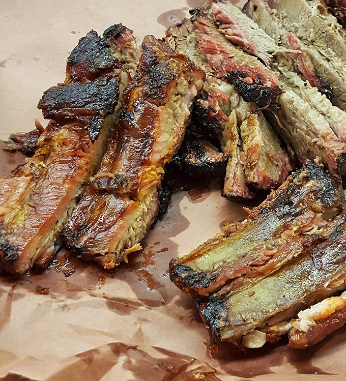 Beef ribs: where dinosaur-sized portions meet caveman satisfaction. These aren't just ribs&mdash;they're meat lollipops for grown-ups.