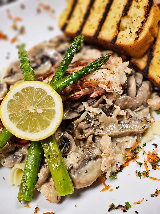 A symphony of mushrooms, tender beef, and fresh asparagus that would make any Eastern European grandmother nod in approval. That grilled bread is begging for a sauce swipe.