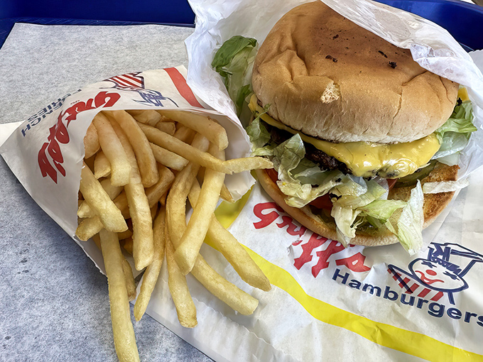 The classic combo: burger, fries, and wrapper art that belongs in the fast food Louvre. Simple pleasures that outshine any fancy tasting menu.