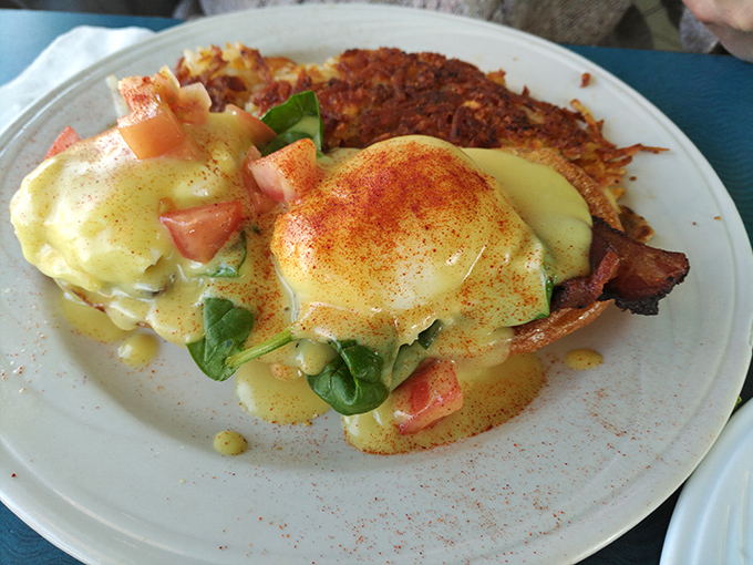 Eggs Benedict here isn't just breakfast&mdash;it's performance art with hollandaise as the headliner, paprika as the spotlight, and spinach stealing scenes throughout.