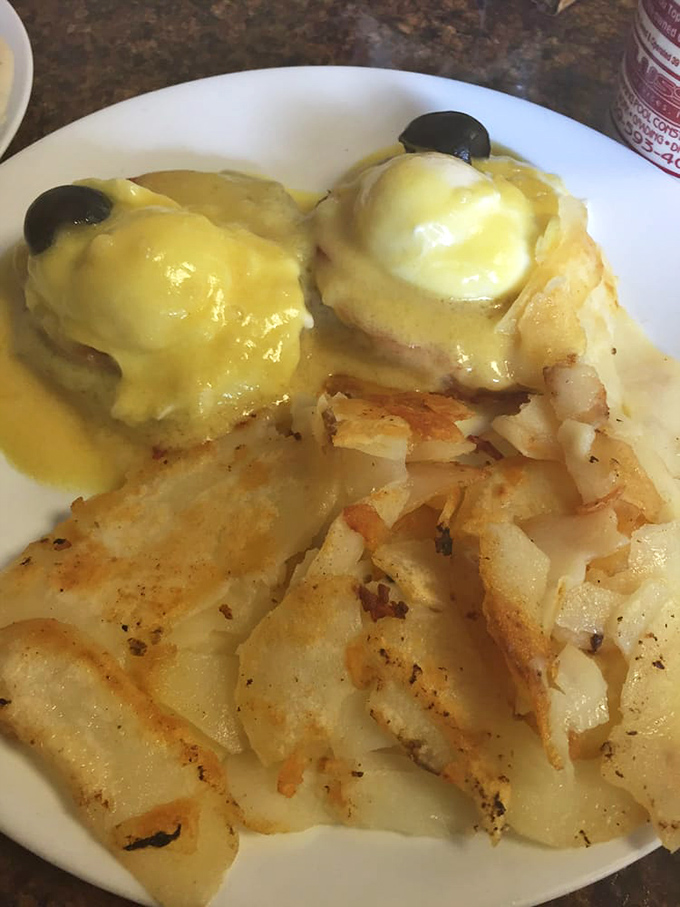 Eggs Benedict done right&mdash;perfectly poached eggs nestled on Canadian bacon, draped in hollandaise that's clearly made with care, not from a packet.