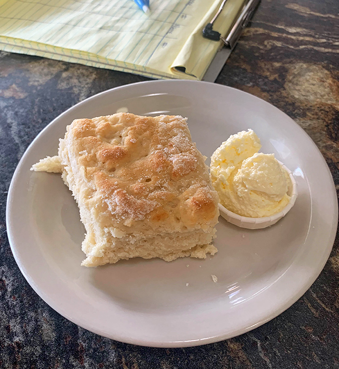 This fluffy biscuit with a side of butter isn't just breakfast &ndash; it's a pillow of happiness waiting for your face.