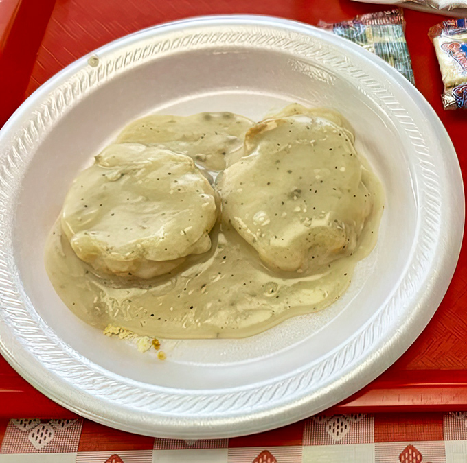 These biscuits smothered in creamy pepper gravy aren't just breakfast; they're Southern poetry on a plate, telling stories with every buttery bite.