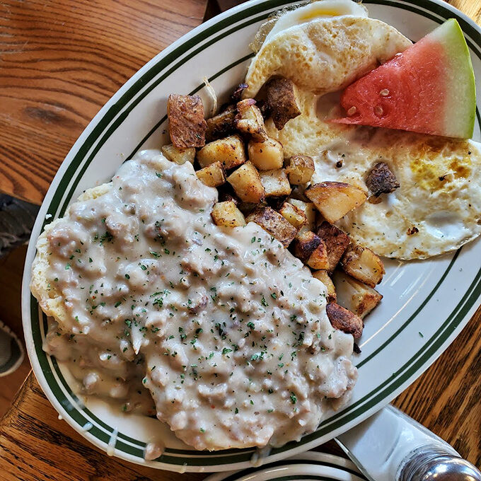 Country gravy that doesn't just cover the biscuits but embraces them &ndash; the kind of stick-to-your-ribs breakfast that fuels Vermont adventures.