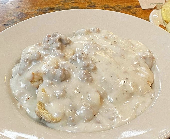 Biscuits and gravy so comforting it could end family feuds &ndash; a creamy, peppery blanket covering pillowy biscuits that would make any grandma proud.