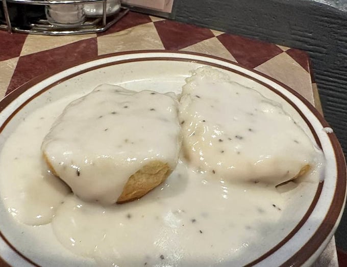 These biscuits and gravy aren't just a meal&mdash;they're a Southern handshake. Creamy, peppery gravy blanketing fluffy biscuits in a warm Tennessee embrace.