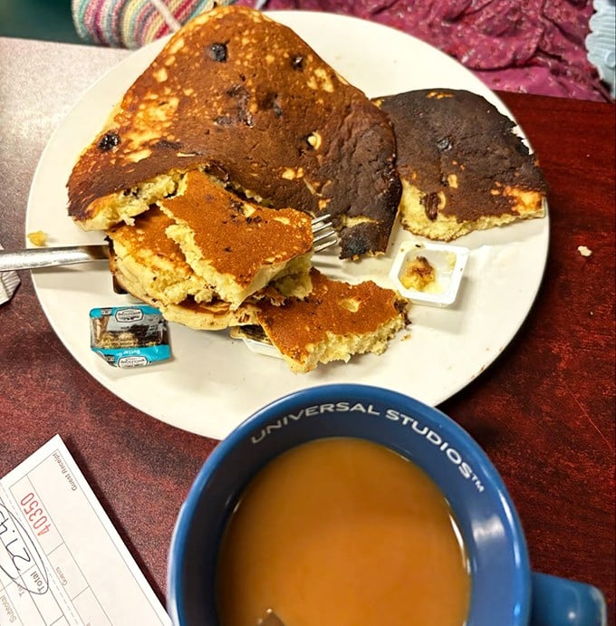 These blueberry pancakes have more personality than most people you'll meet today. The coffee mug says Universal Studios, but the taste says "universal delight."