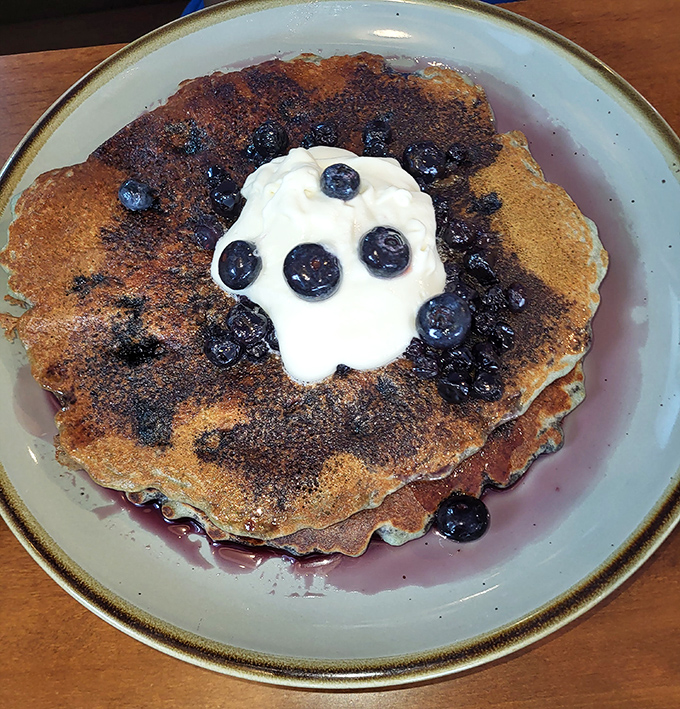 These blueberry pancakes aren't just breakfast, they're edible art&mdash;a canvas of golden batter dotted with bursts of purple-blue joy.