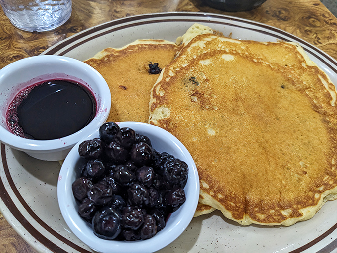 Golden pancakes with fresh blueberries&mdash;nature's candy&mdash;served with their own purple juice that's practically begging to mingle with real maple syrup.