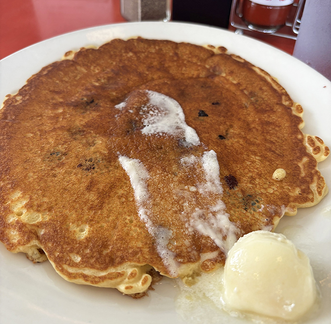These blueberry pancakes aren't trying to win a beauty contest&mdash;they're too busy being exactly what pancakes should be: fluffy, golden, and ready for their butter bath.
