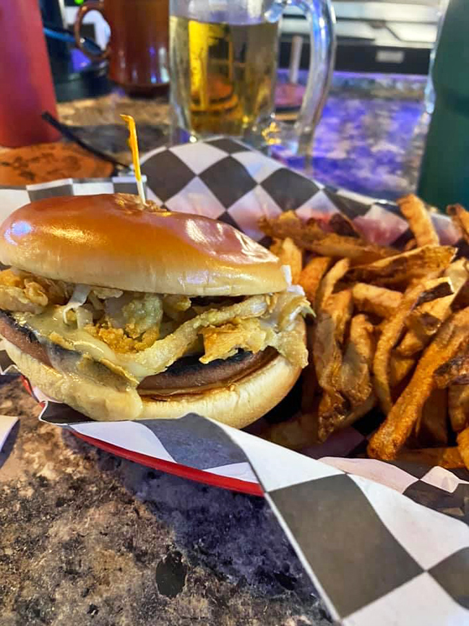 A sandwich that demands both hands and your full attention, paired with fries that achieve that perfect crispy-to-fluffy ratio.