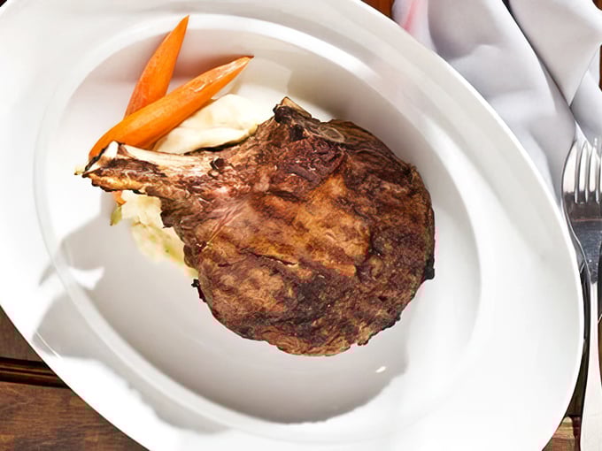 This bone-in ribeye isn't just a steak&mdash;it's a monument to bovine excellence that would make Fred Flintstone weak at the knees.