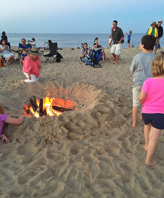 Nothing says "summer perfected" like a beach bonfire with friends as twilight embraces the shoreline.