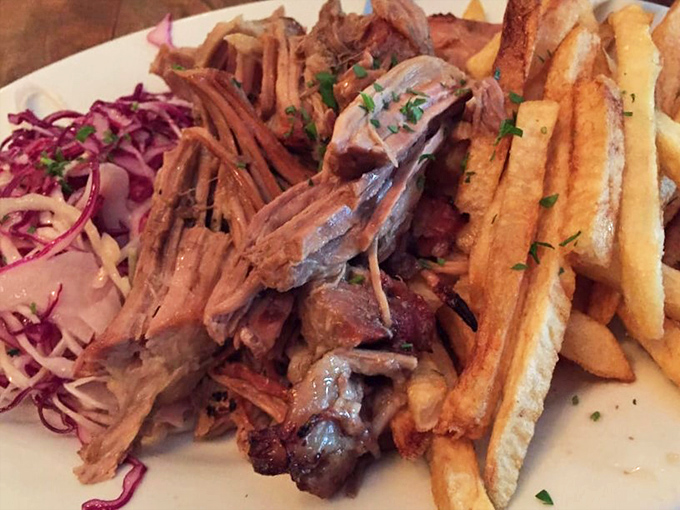 Fork-tender braised pork that would make a Serbian grandmother weep with joy, served with crispy fries and a vibrant slaw.