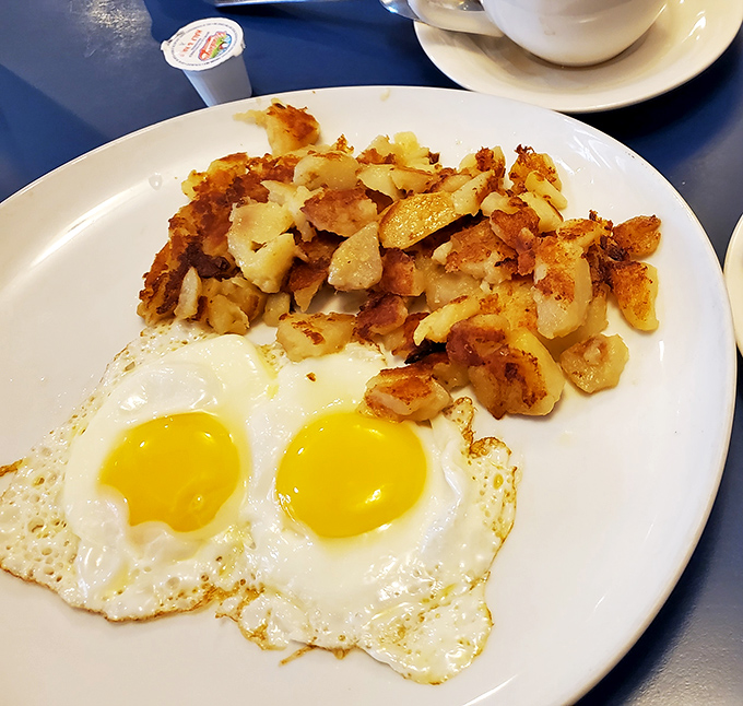 Sunny-side up eggs with a side of home fries that would make your grandmother nod in approval. Breakfast perfection knows no time zone.