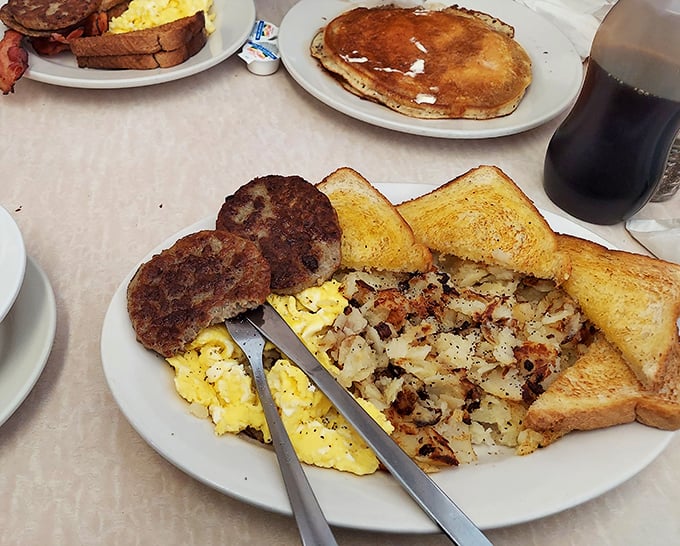 Breakfast perfection on a plate&mdash;crispy sausage patties, fluffy eggs, and hash browns that crackle with each bite. Morning salvation for $8.99.