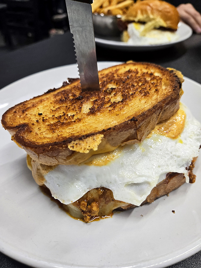 Behold the breakfast sandwich in its natural habitat &ndash; perfectly grilled bread embracing a sunny egg with the kind of hug we all need on Monday mornings.