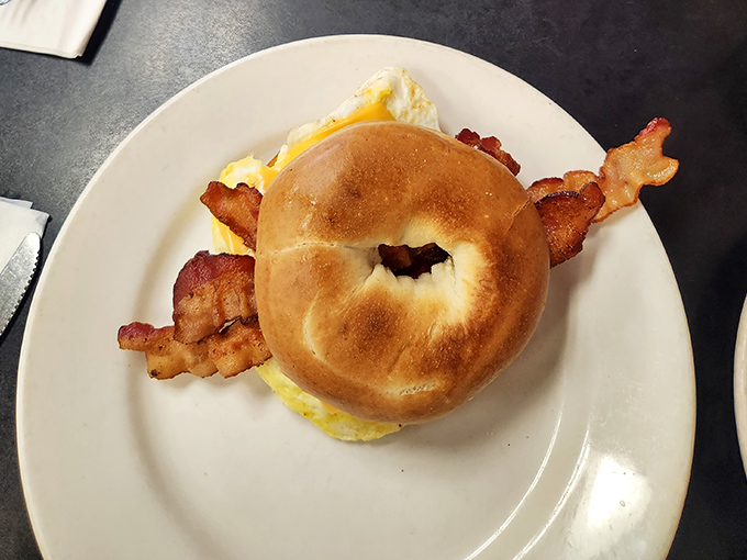 Breakfast perfection on a bagel. When eggs, bacon, and cheese meet this way, hitting snooze becomes the day's biggest regret.