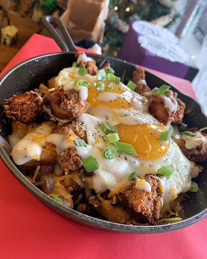 Breakfast alchemy at its finest&mdash;crispy potatoes, melted cheese, and perfectly fried eggs topped with crispy chicken. Morning salvation in cast iron. 
