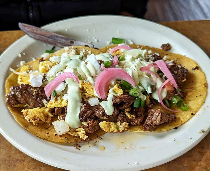 Breakfast tacos that would make Texas jealous. Those pickled red onions cut through the richness like a well-timed punchline.